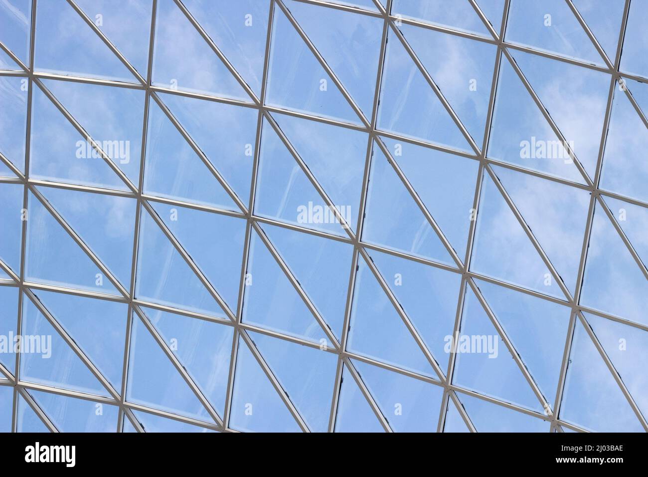 A fragment of a glass dome on the roof of the building. Geometric glass ...