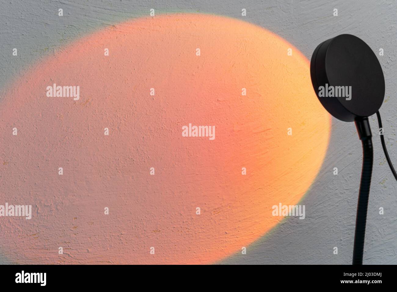 Sunset LED RGB lighting decor. Shadow on surface illuminated by ...