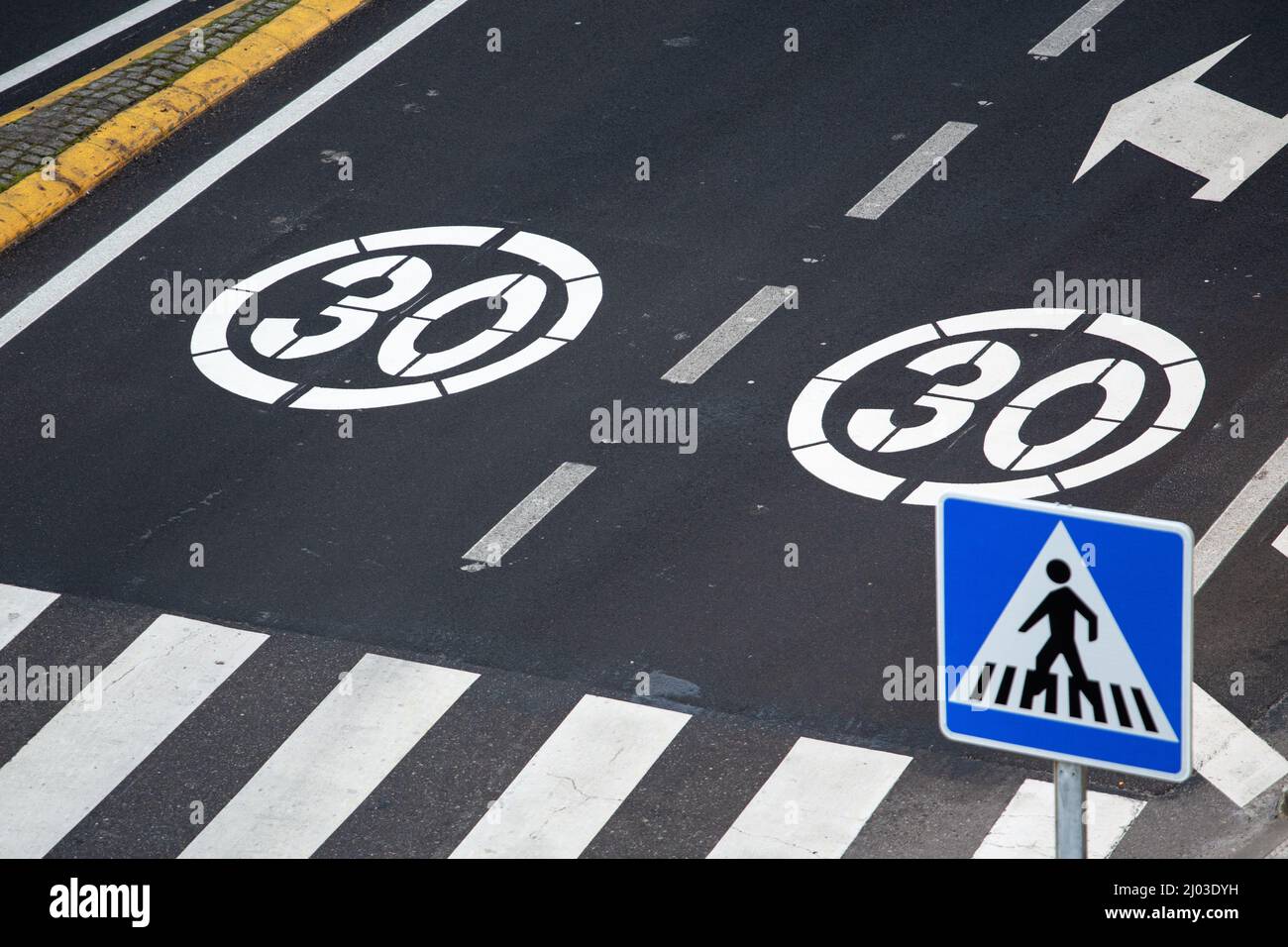 30 kilometers hour speed limit sign painted on city road Stock Photo - Alamy