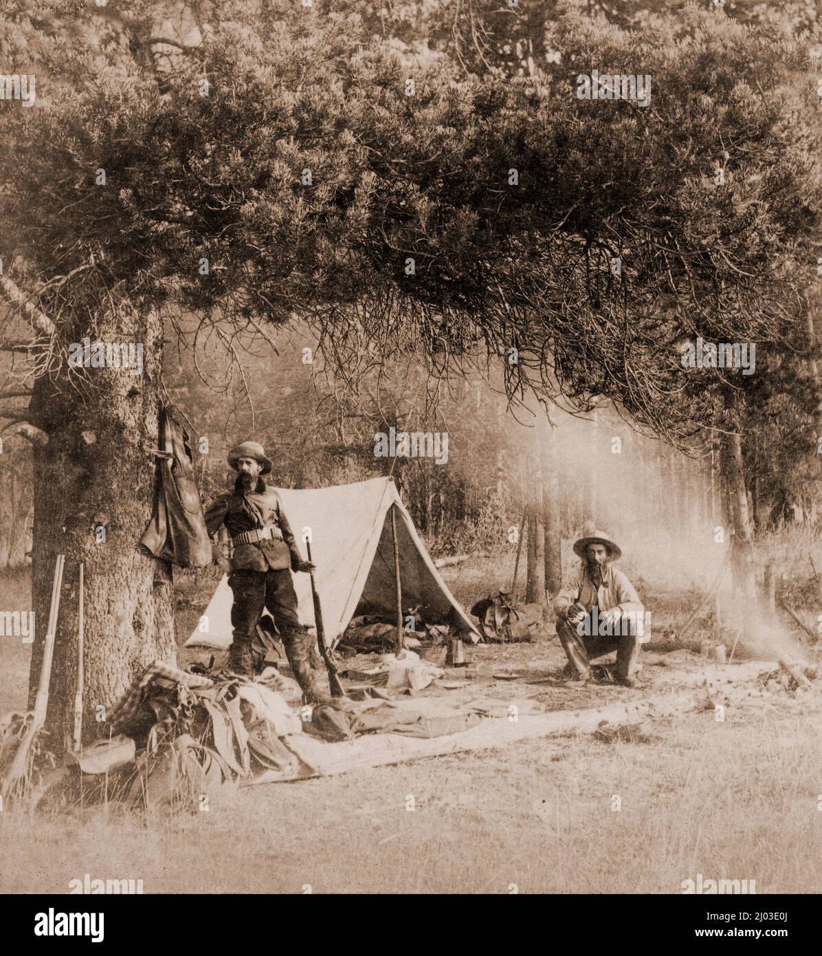 Trappers hunters camp near Lake Abundance with tent, rifles and camp ...