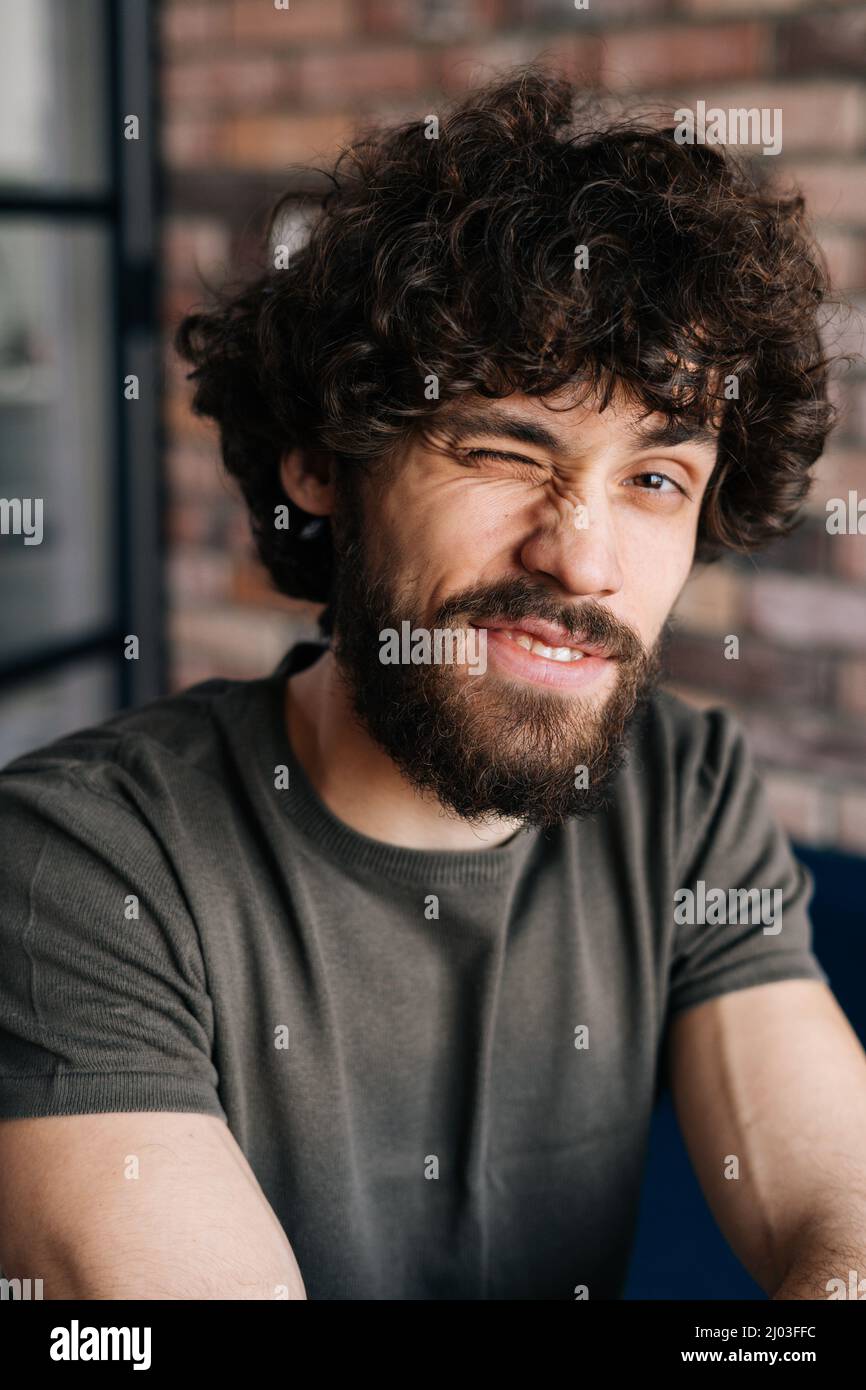 Person winking camera portrait face hi-res stock photography and images ...