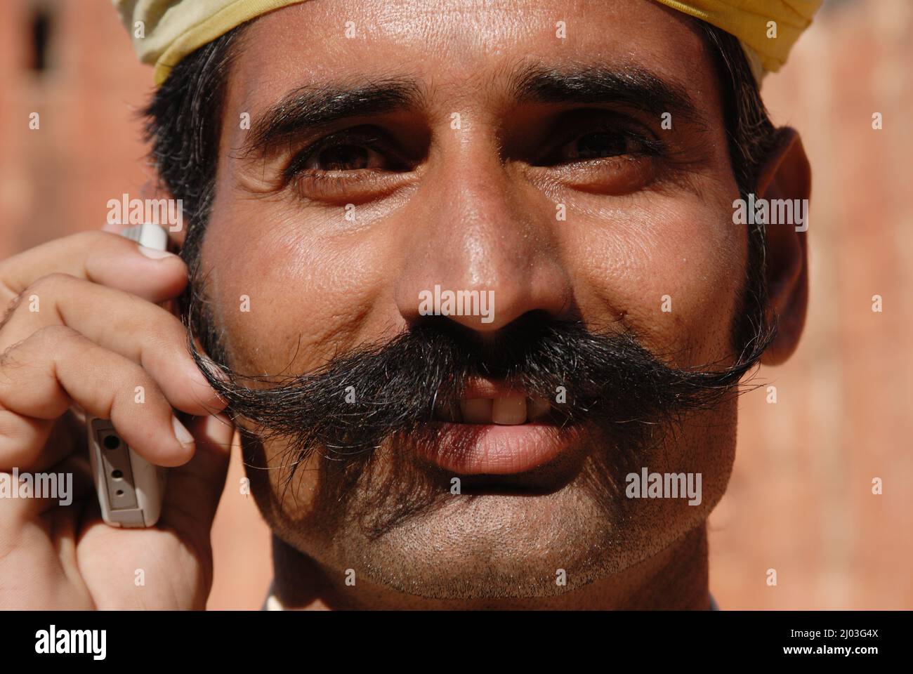 Indian talking mobile phone human face hi-res stock photography and ...