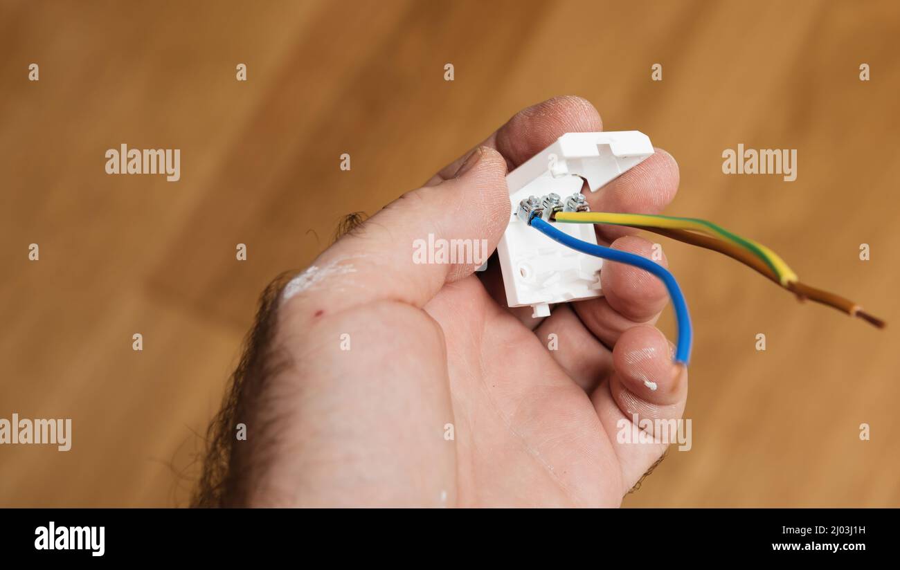 Personal perspective male hand holding during renovation reconstruction ...