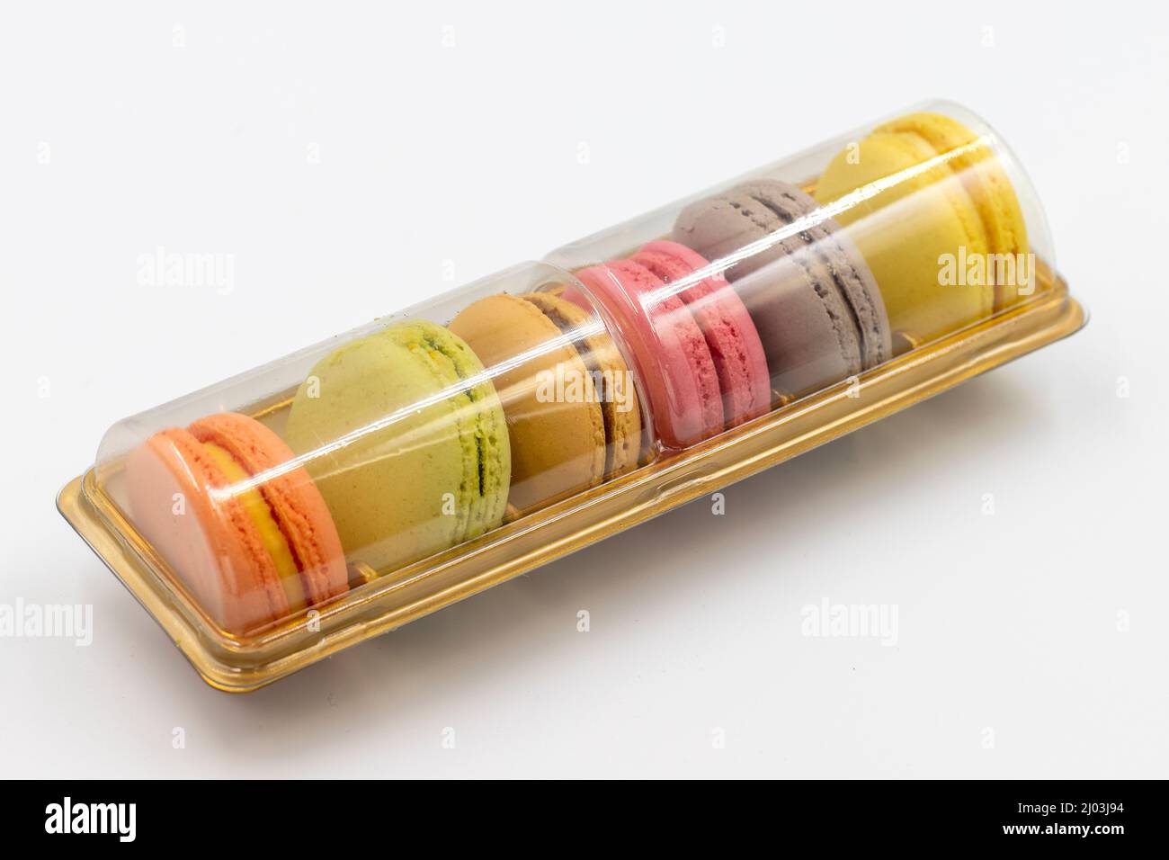 Packaged macaroon dessert on a white background. Colorful macarons ...
