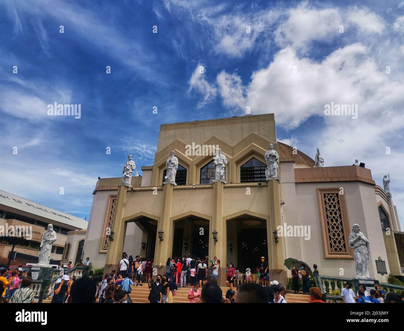 Low angle shot of a historic building under a blue sky in Metro Manila ... Low angle shot of a historic building under a blue sky in Metro Manila ...