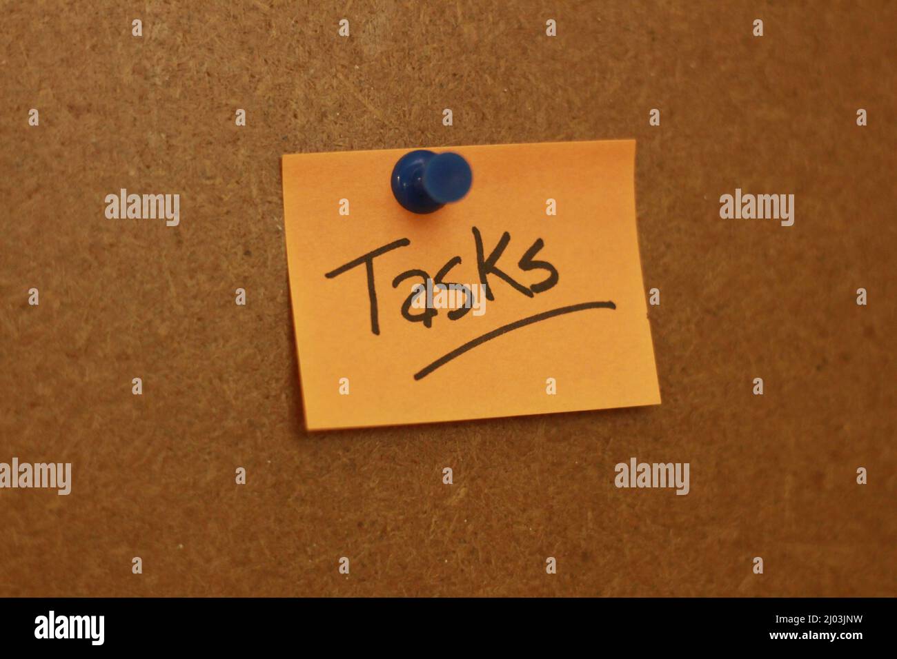 tasks written on sticky note concept designed with woman hand Stock ...