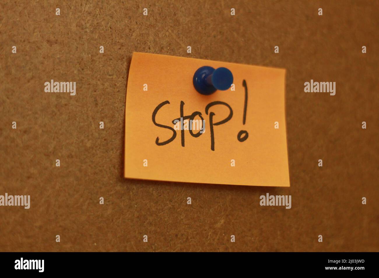 Stop text written on sticky note designed with woman hand Stock Photo ...