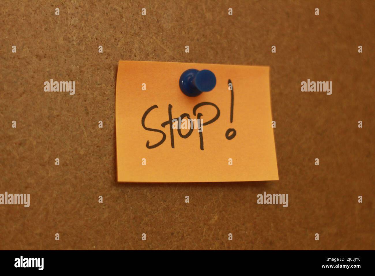 Stop text written on sticky note designed with woman hand Stock Photo ...