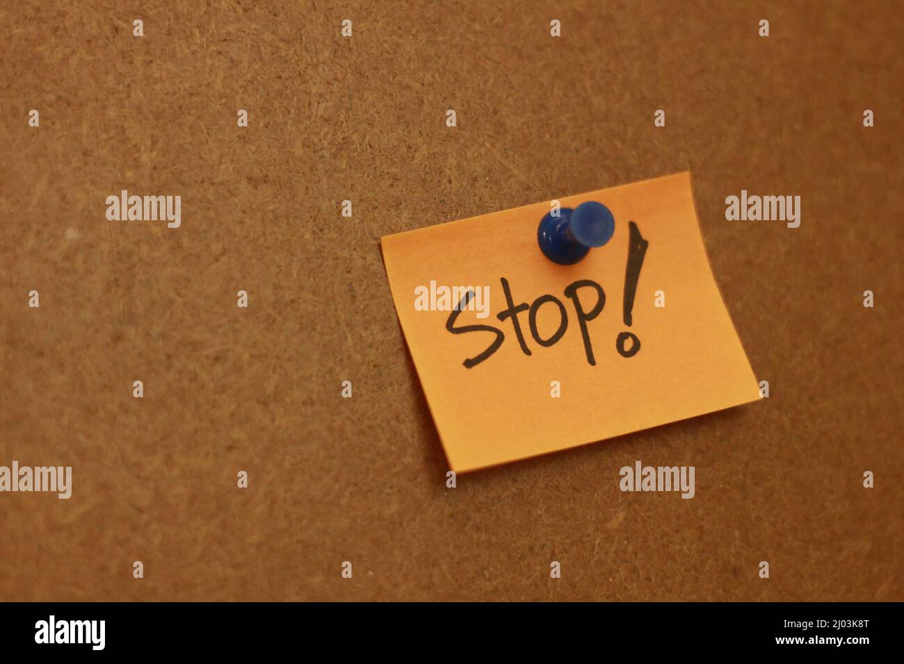 Stop text written on sticky note designed with woman hand Stock Photo ...
