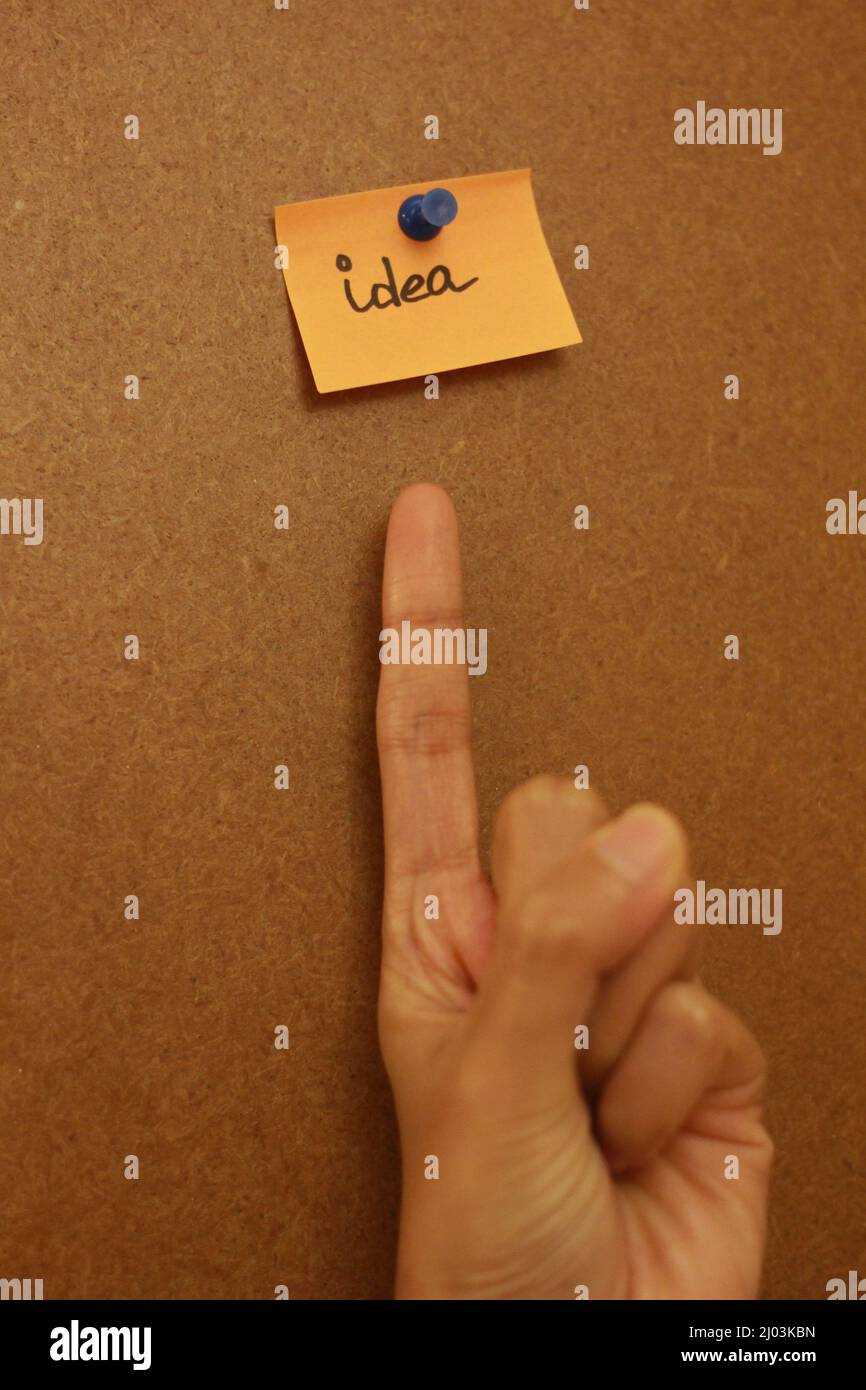 Idea text written on sticky note concept designed with woman hand Stock ...