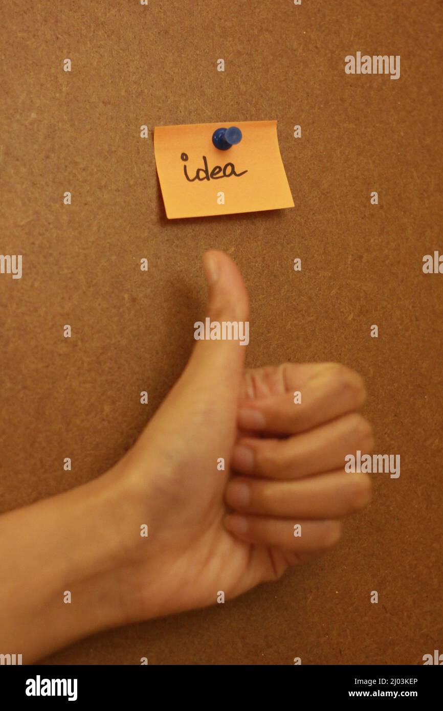 Idea text written on sticky note concept designed with woman hand Stock ...