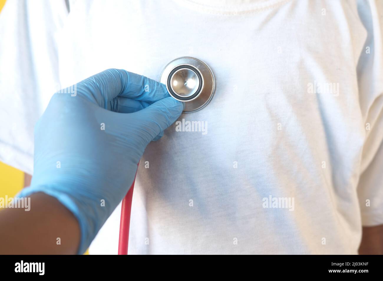 Doctor using a stethoscope checking child body, close up Stock Photo ...