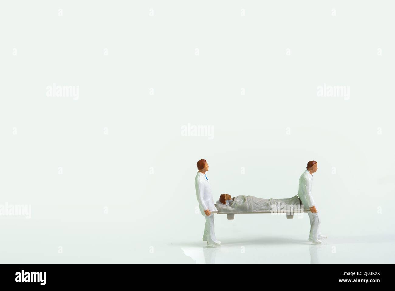 two male nurses with white coats carry a patient with a stretcher Stock ...