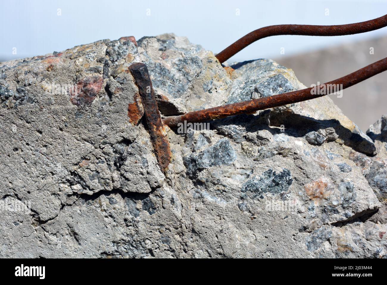 Building materials, a broken piece of gray reinforced concrete wall ...
