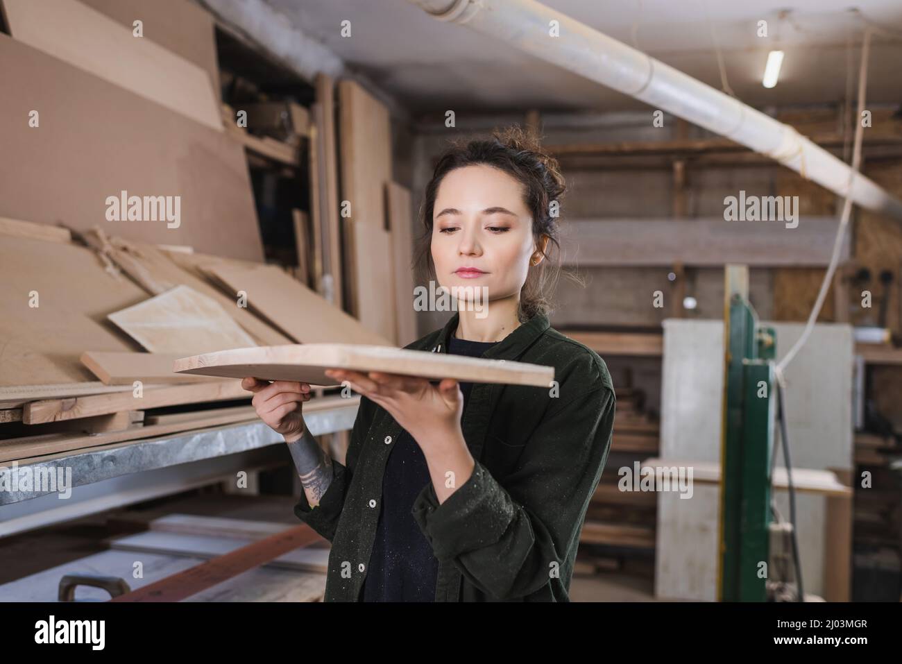 Beautiful young woman carpenter hi-res stock photography and images - Alamy