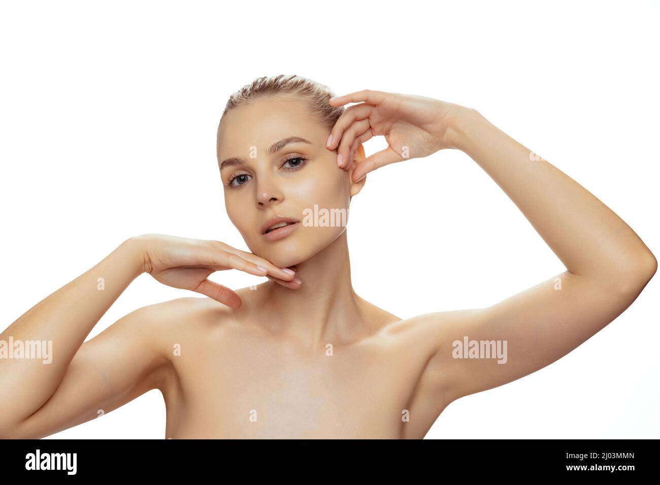 Portrait Of Young Beautiful Woman Having Hands Near Face Tenderly Posing Isolated Over White