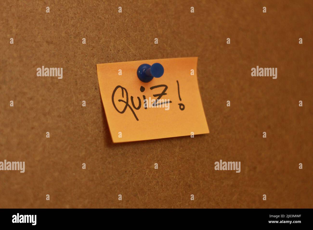 Quiz written on sticky note concept designed with woman hand Stock ...