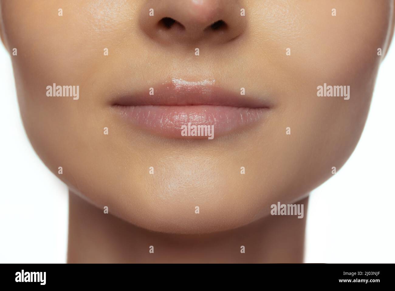 Cropped image of beautiful female lips, neck and chin isolated over ...