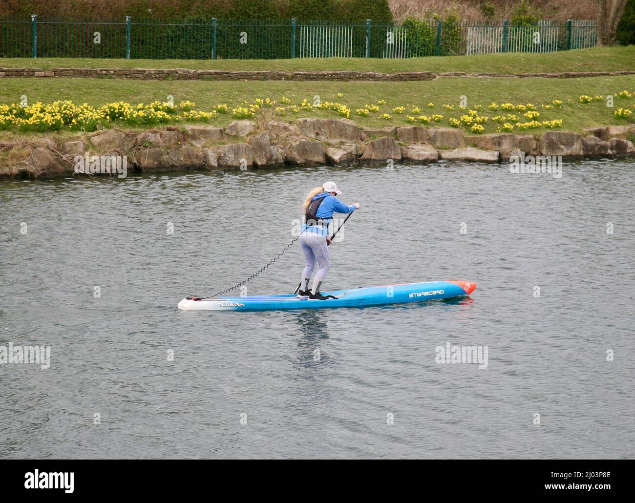 A view of a paddle boarder on the marine lake at Southport, Merseyside ...