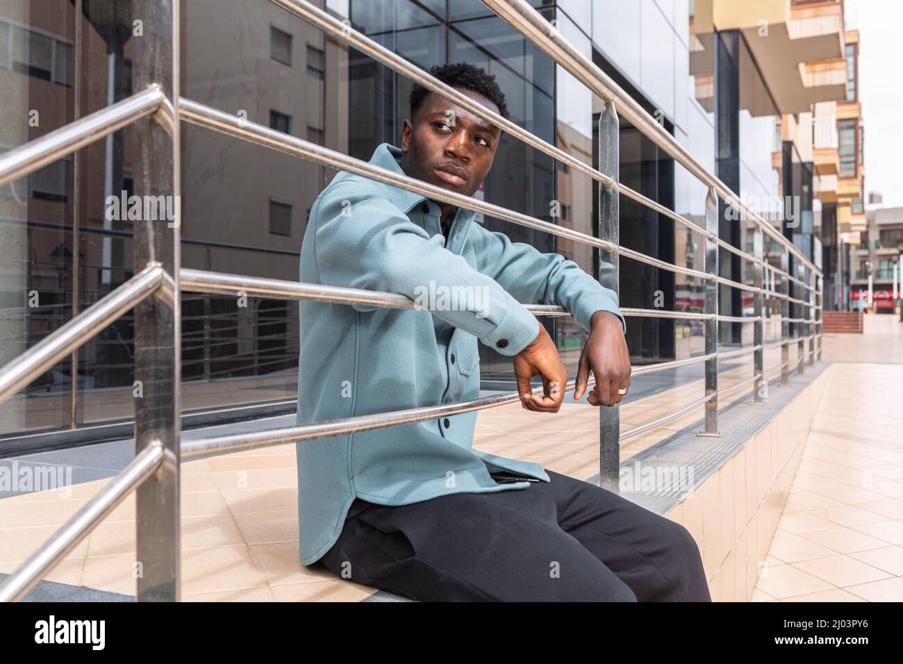 Male lean railing hi-res stock photography and images - Alamy