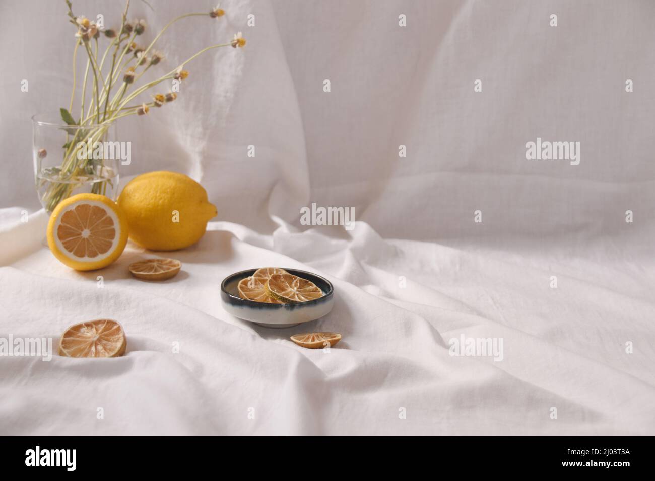 Dried lemon slices on a white delicate background showing the Spring ...
