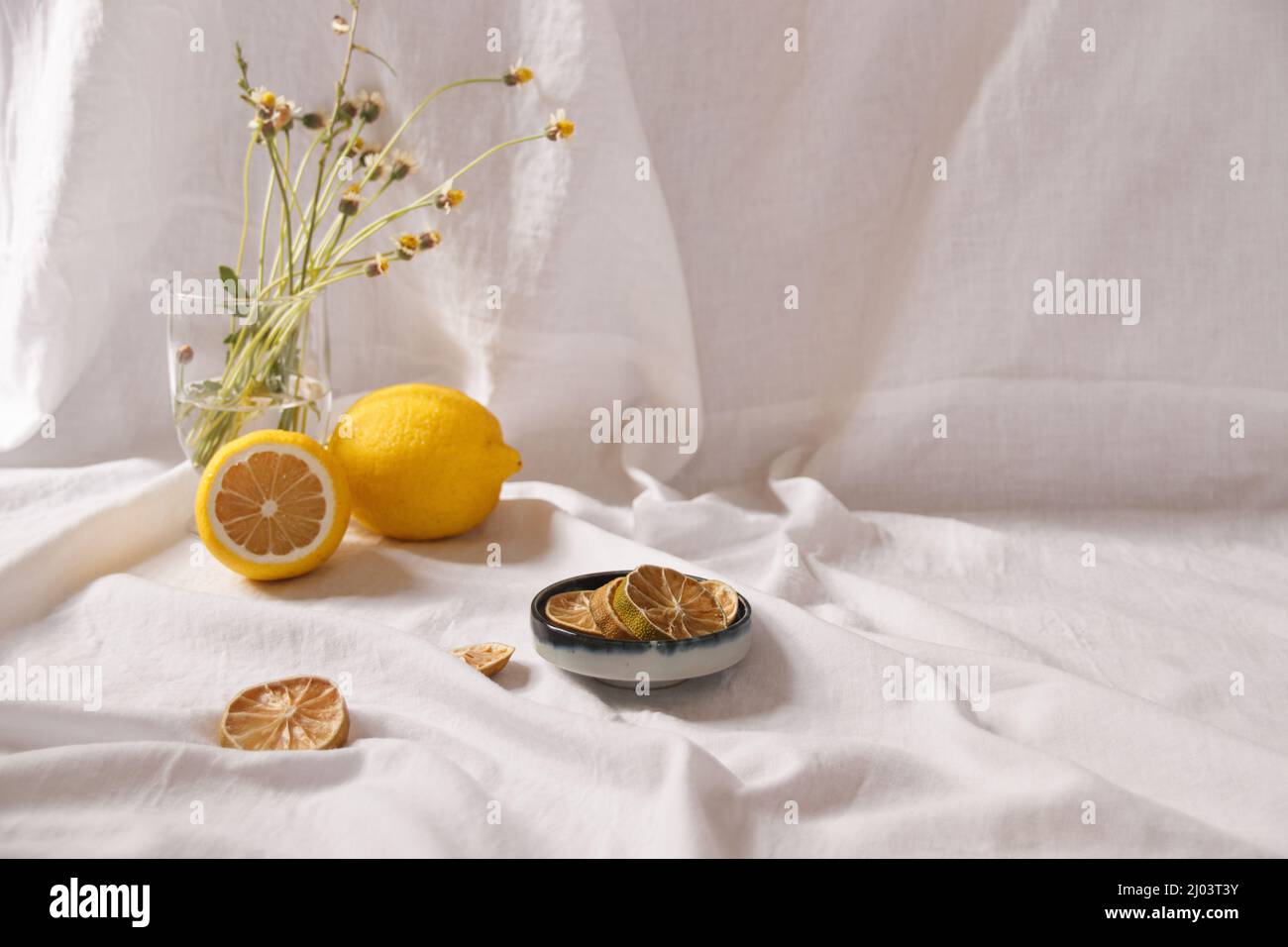 Dried lemon slices on a white delicate background showing the Spring ...