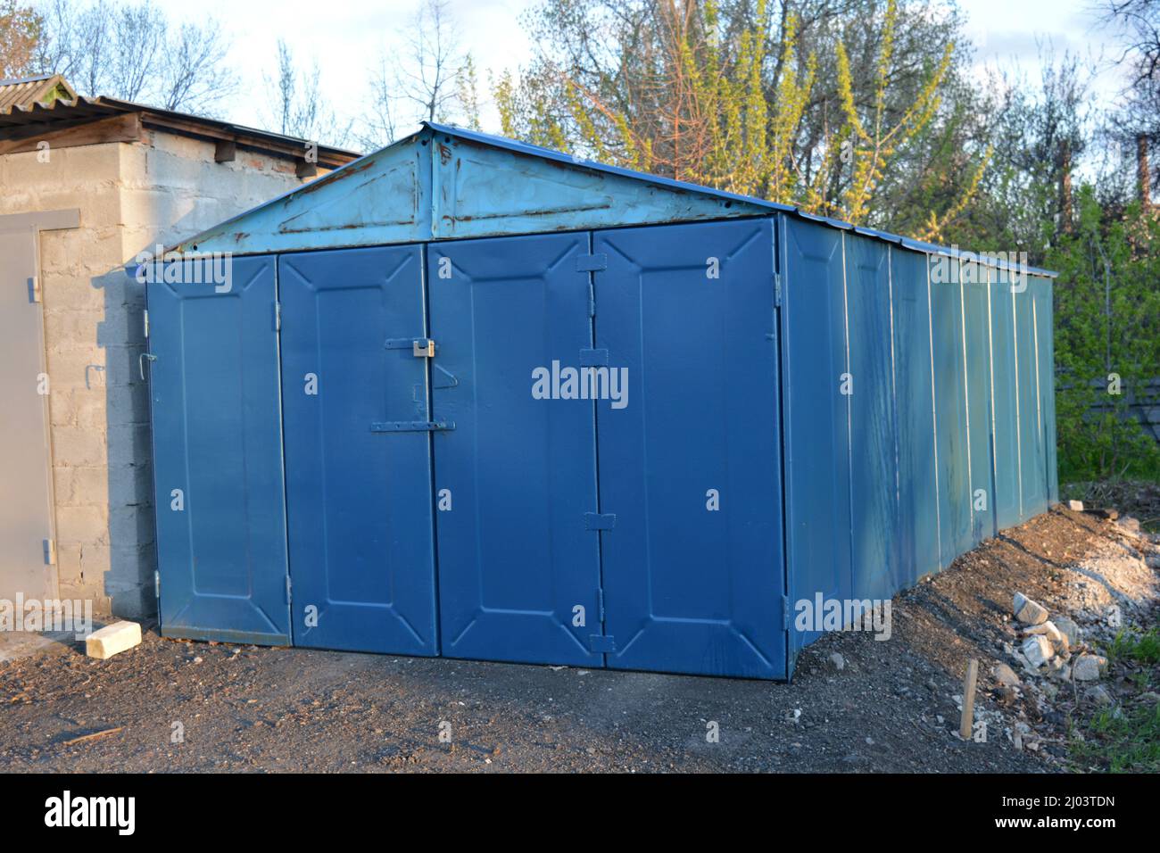 Blue plastic shed in the open air. Close-up shot. Old buildings ...
