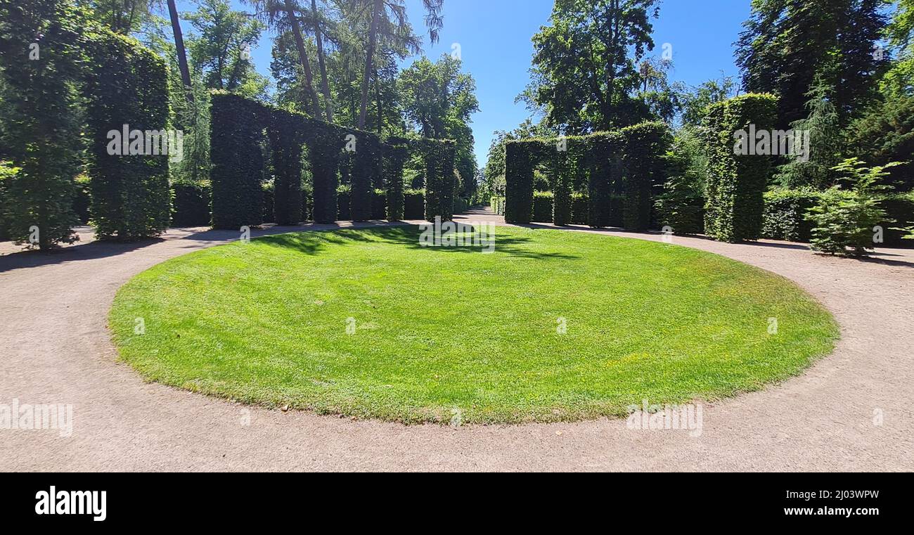 Beautiful shot of a round grass field surrounded by pillars made of ...