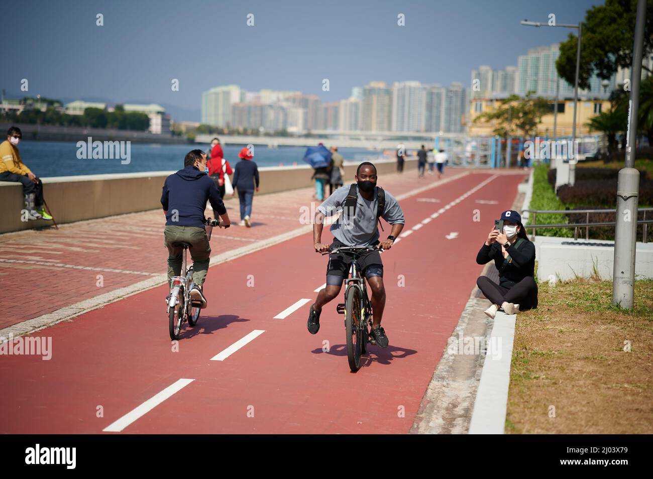 Male riding bicycle next to Shing Mun river in Hong Kong Stock Photo ...