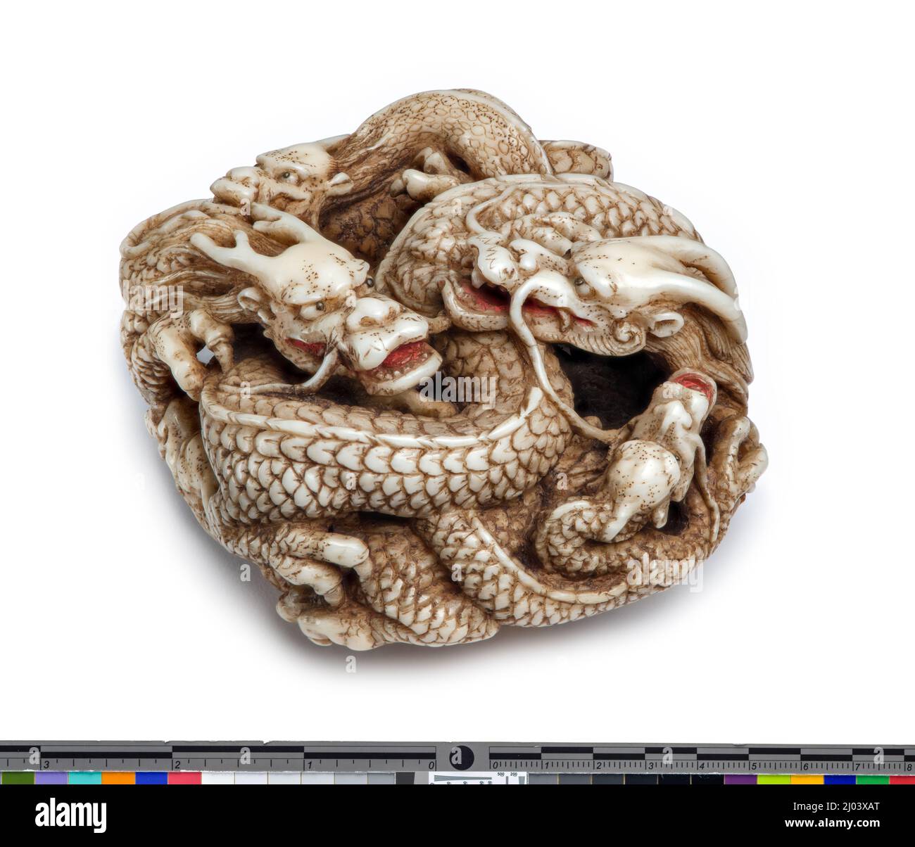 Ivory with staining sumi red pigment inlays hi-res stock photography ...