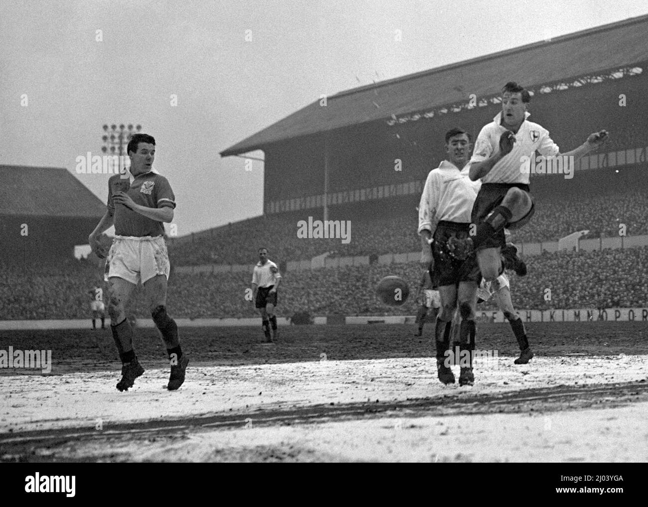 File photo dated 12-02-1955 of Tottenham Hotspur's Tony Marchi clearing ...