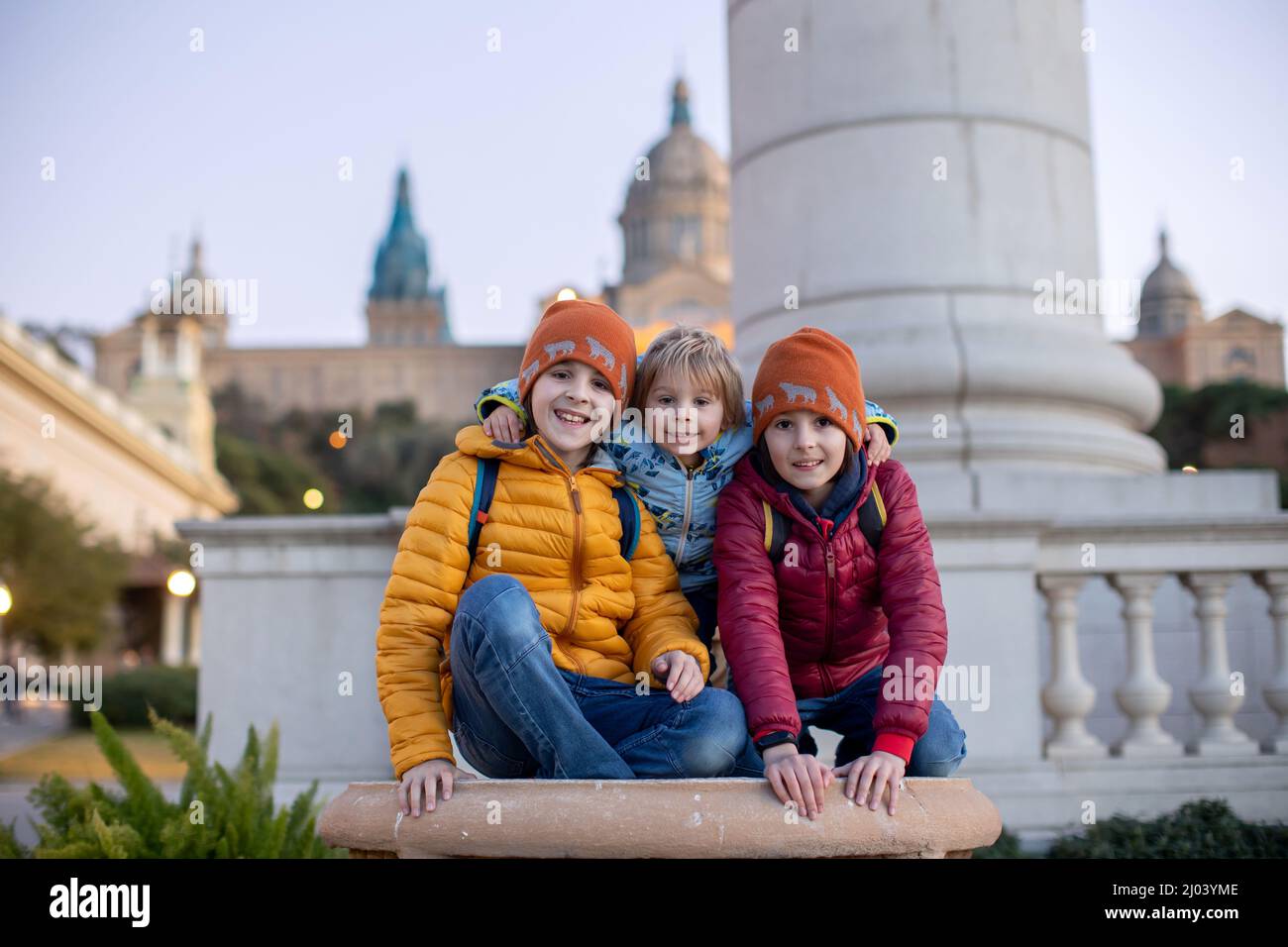 Three children, boy siblings, enjoying sightseeing in Barcelona, Spain ...