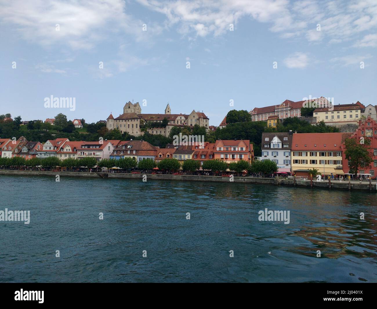 The buildings on the shore of lake Constance (Bodensee) against blue ...