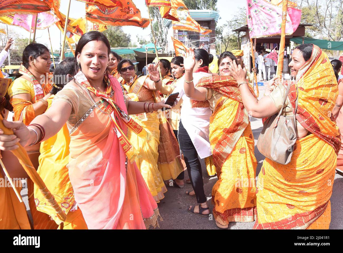 Bikaner, India. 15th Mar, 2022. Devotees dancing, carrying yellow flags ...