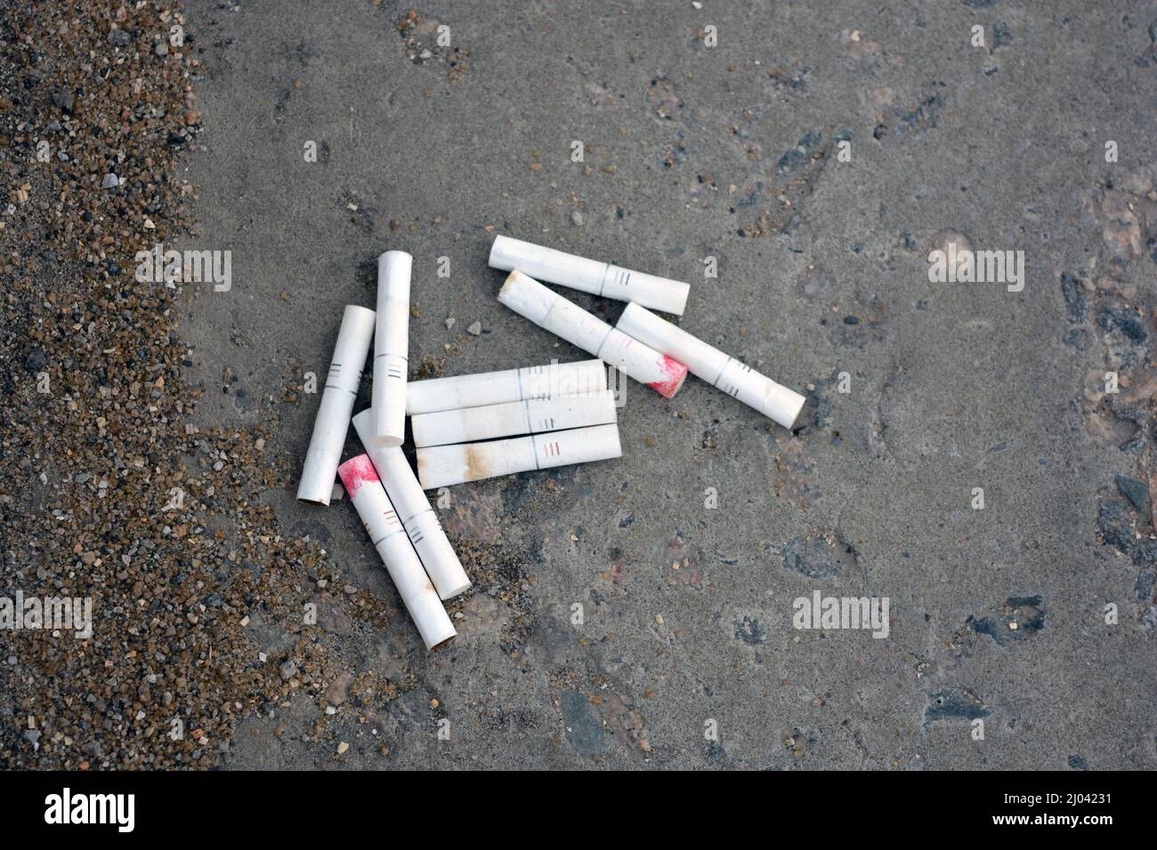 Lifestyle, smoking that kills health. A lot of half-smoked cigarettes ...