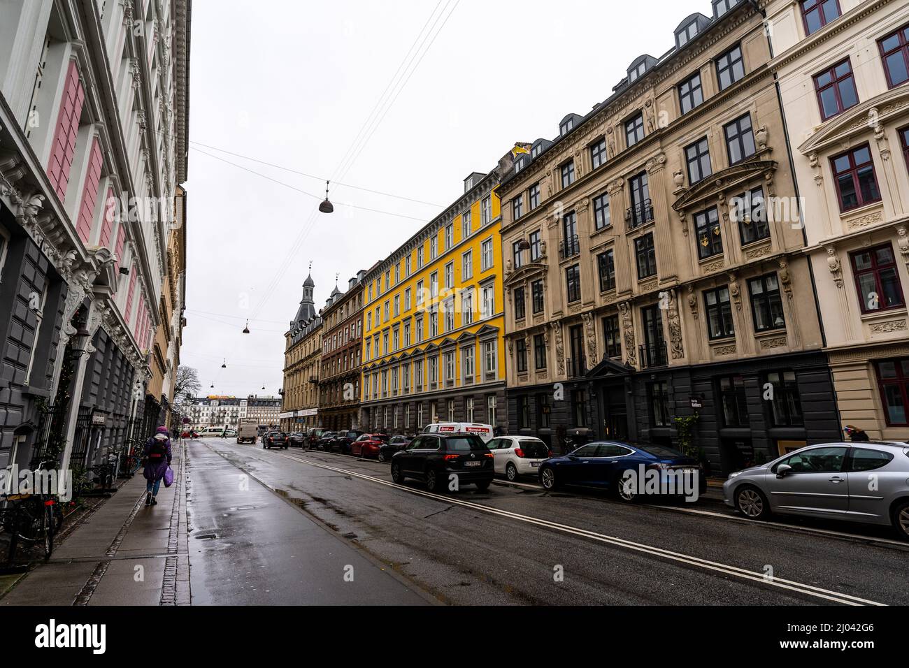 Beautiful shot of cars parked in the streets against old buildings in ...