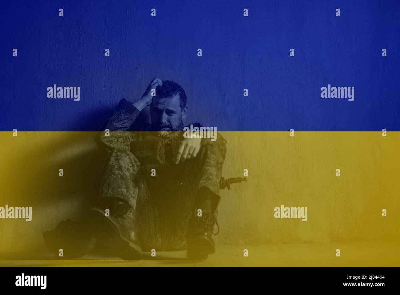 Double exposure of frustrated military soldier sitting crying alone in ...