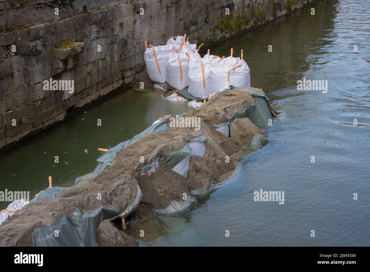 Sandbags for artificial barrier in a river protecting a construction ...