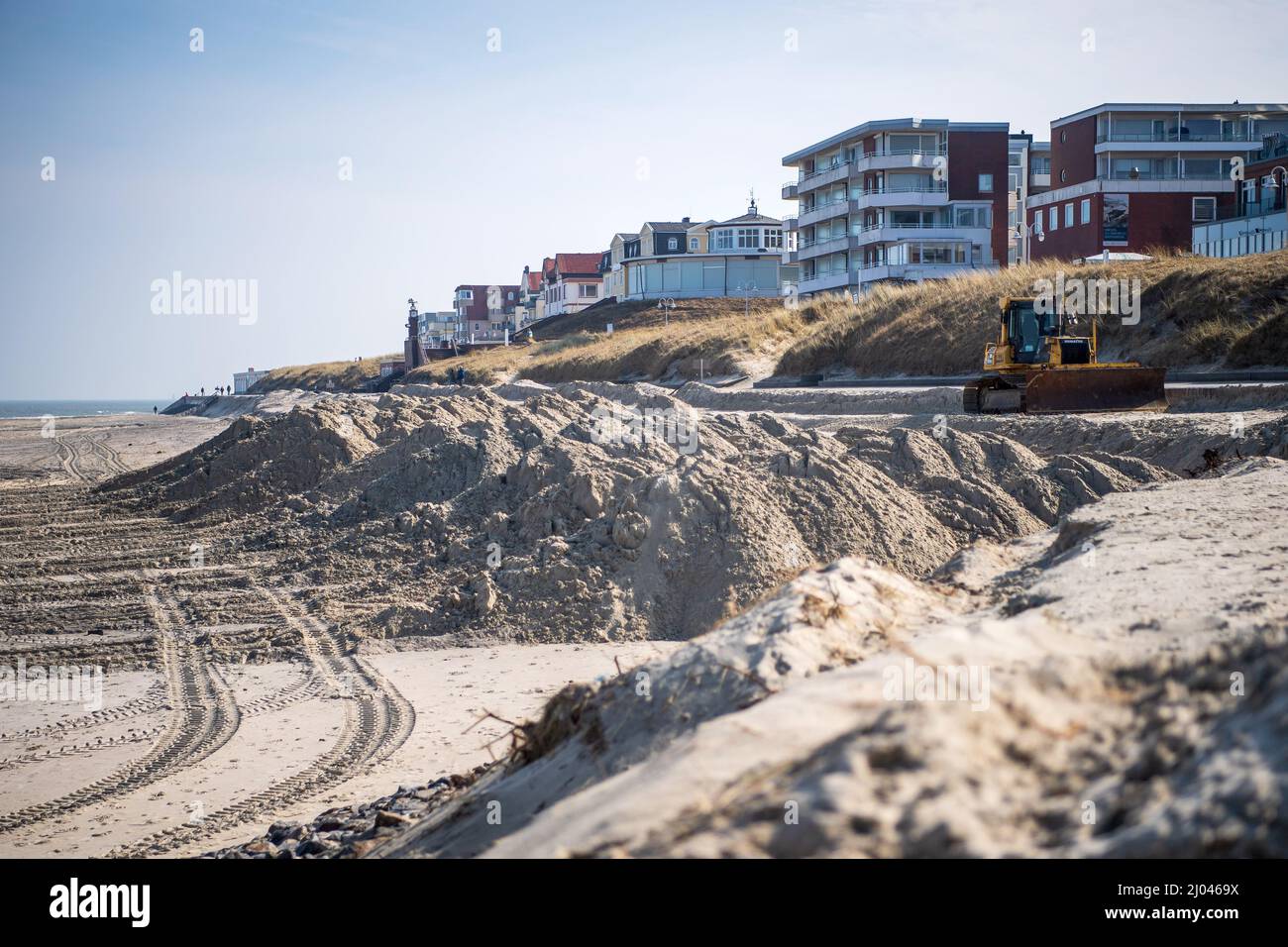 Wangerooge, Germany. 16th Mar, 2022. Sand was piled up on the beach of ...