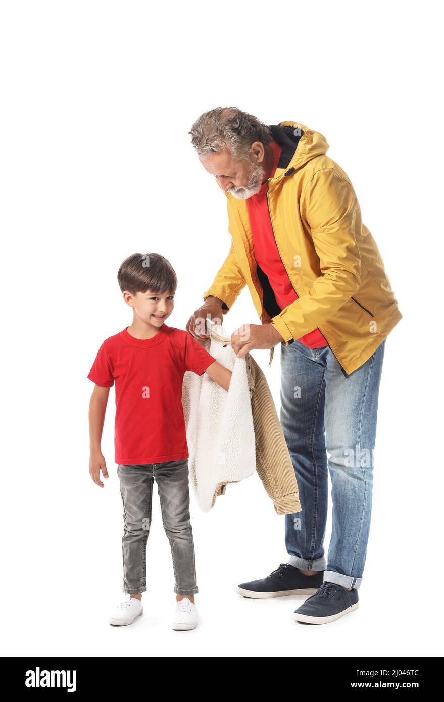Boy putting on jacket hi-res stock photography and images - Alamy