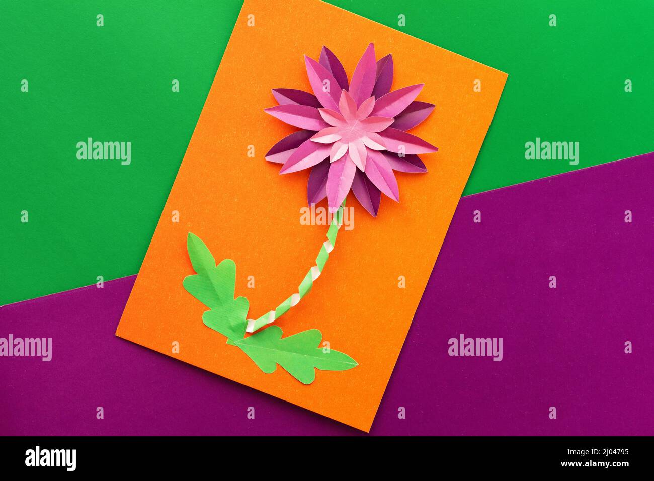 Top view of papercraft violet crysanthemum flower made by child on ...