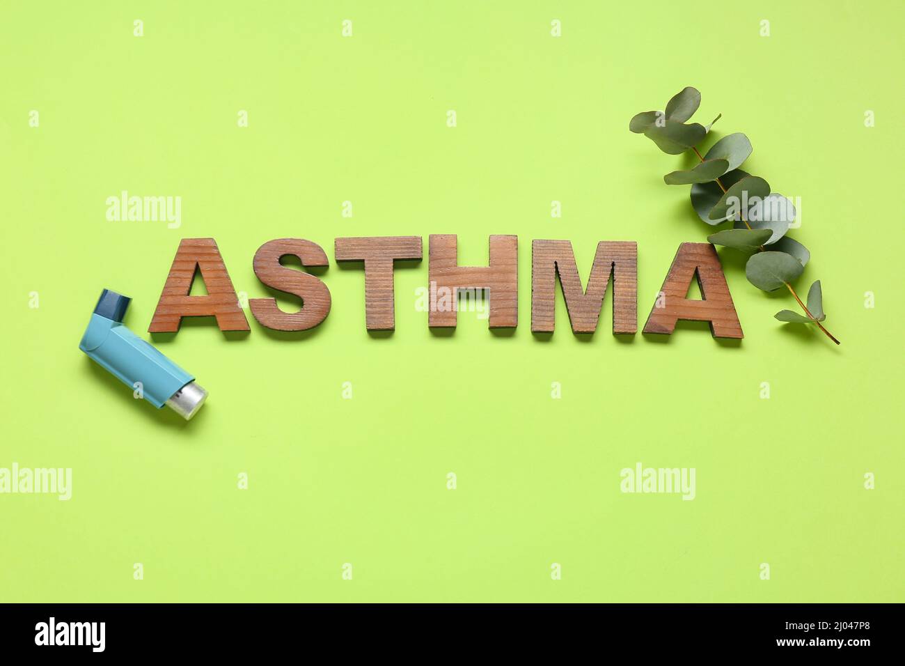 Composition with word ASTHMA made of wooden letters, inhaler and ...