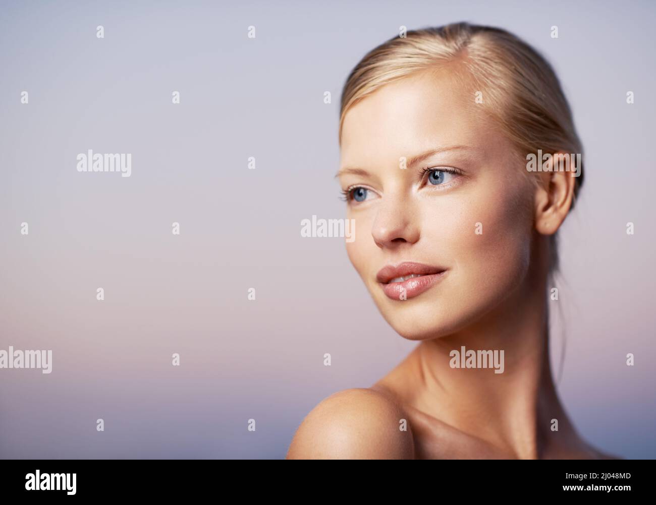 Thinking about new beauty techniques. A beautiful young model glancing ...