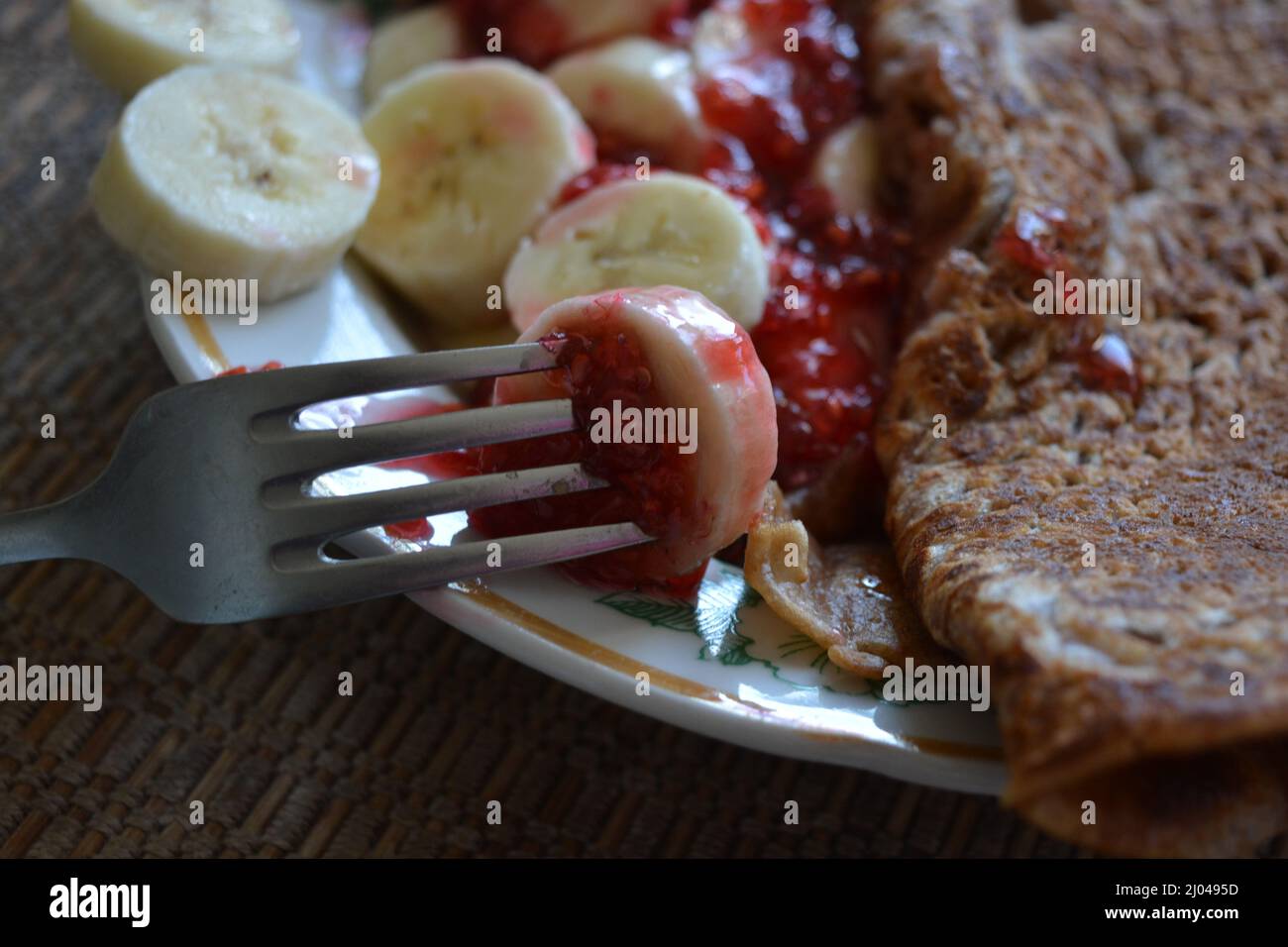 Healthy food, food, fruits. Fresh sliced bananas with sweet raspberry ...