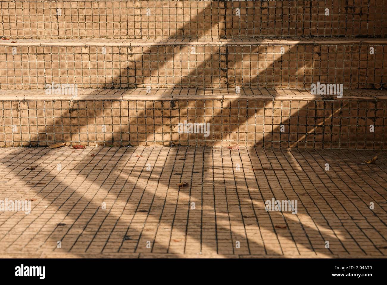 Outdoor brick staircase background with railing shadow Stock Photo - Alamy