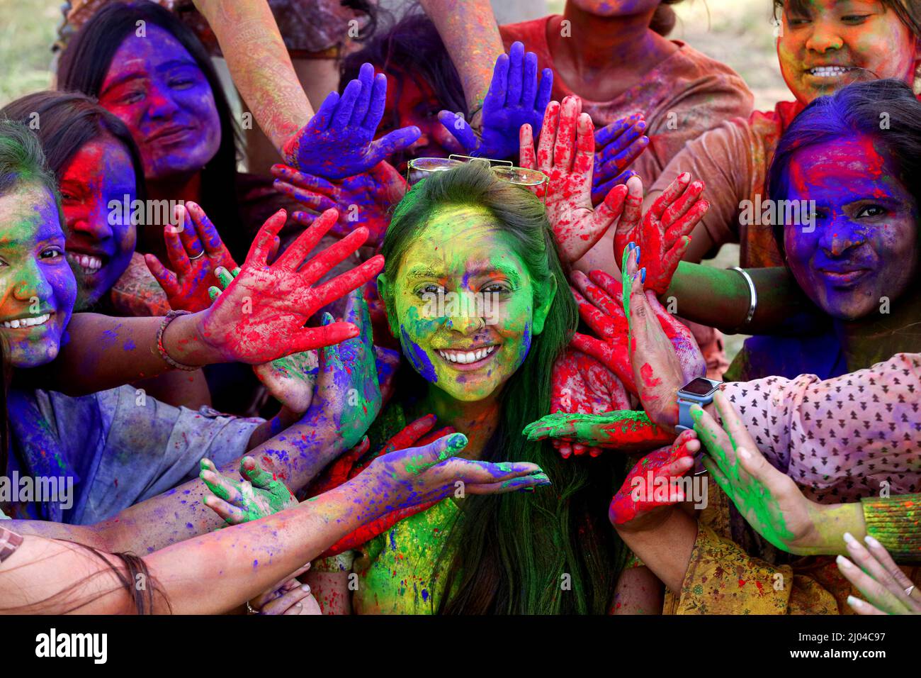 Bhopal, India - 16 Mar 2022, Indian young women apply colors to each other ahead of the Holi ...