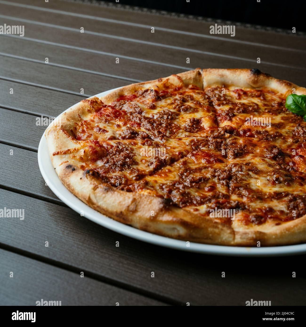 Serving of delicious fresh Italian pizza with meat Stock Photo - Alamy