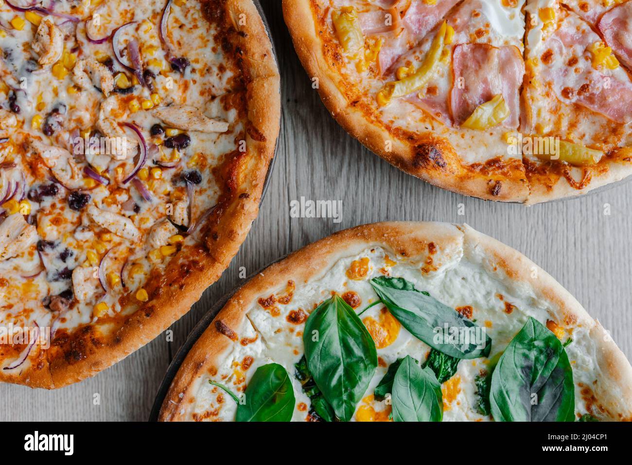 Photo of multiple pizzas on table Stock Photo - Alamy