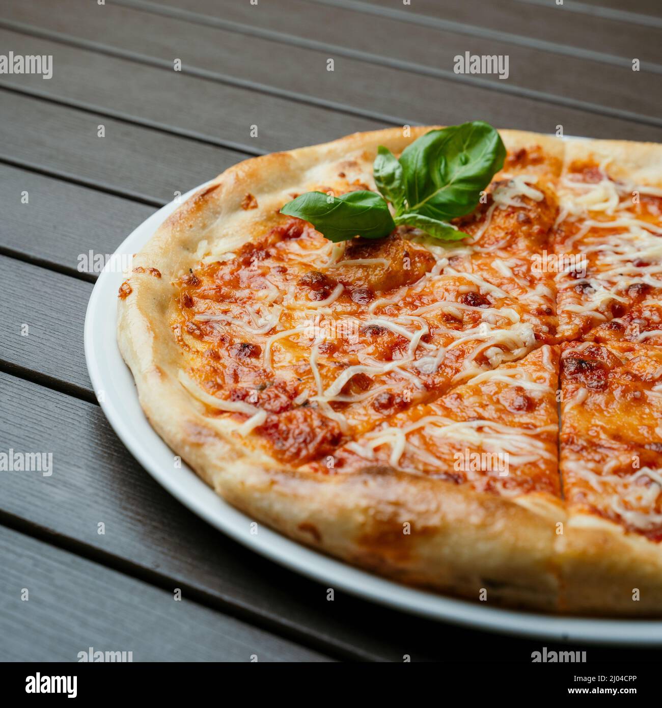 Serving of delicious fresh Italian pizza with meat and chees Stock ...