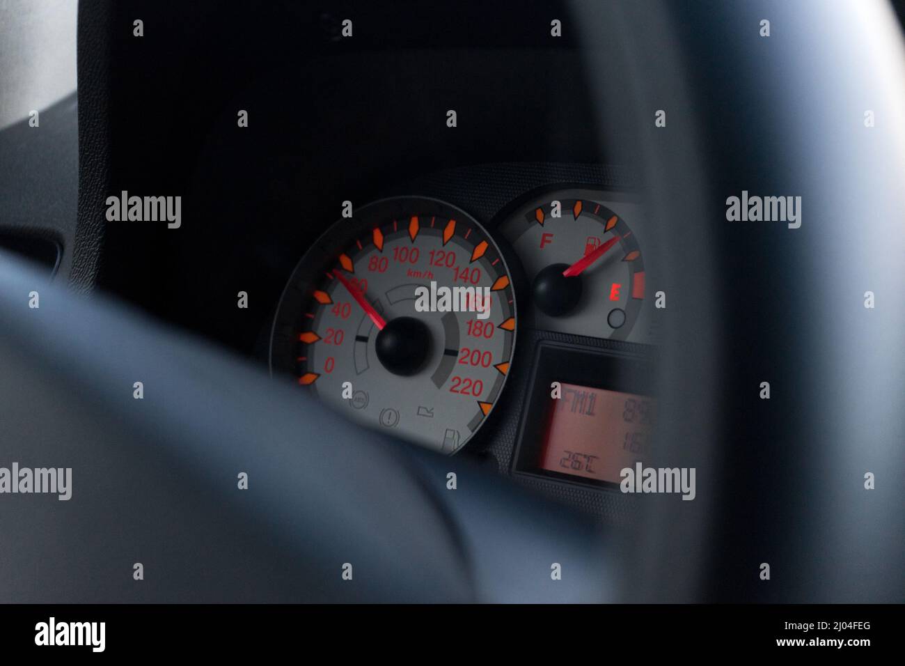 Auto velocimeter on dashboard Stock Photo - Alamy